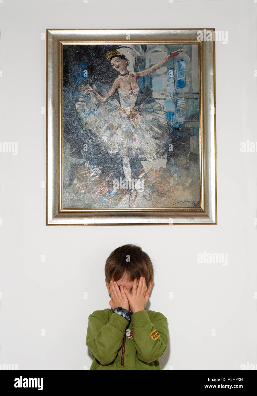 child hides behind his hands Stock Photo - Alamy