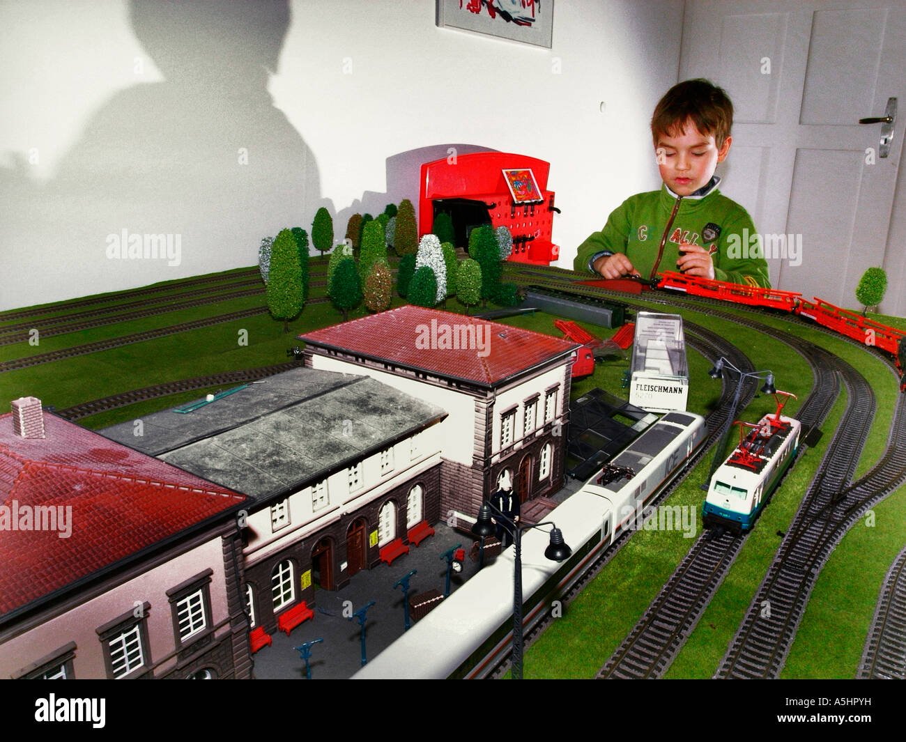 little boy plays with model trains Stock Photo - Alamy