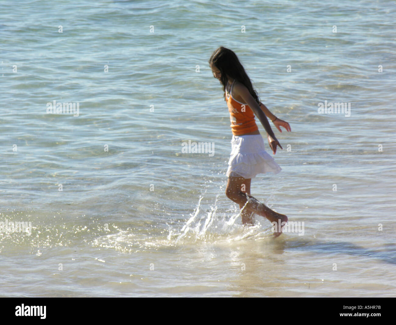 Girl standing in shallow water hi-res stock photography and images - Alamy