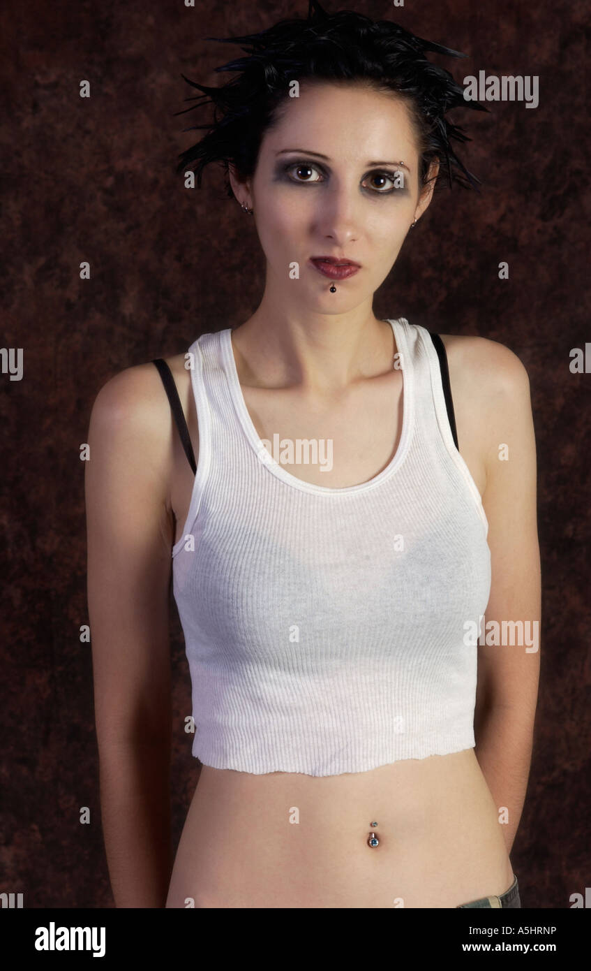 Portrait of a young punk girl in a tank top with piercings Stock Photo ... Portrait of a young punk girl in a tank top with piercings Stock Photo ...