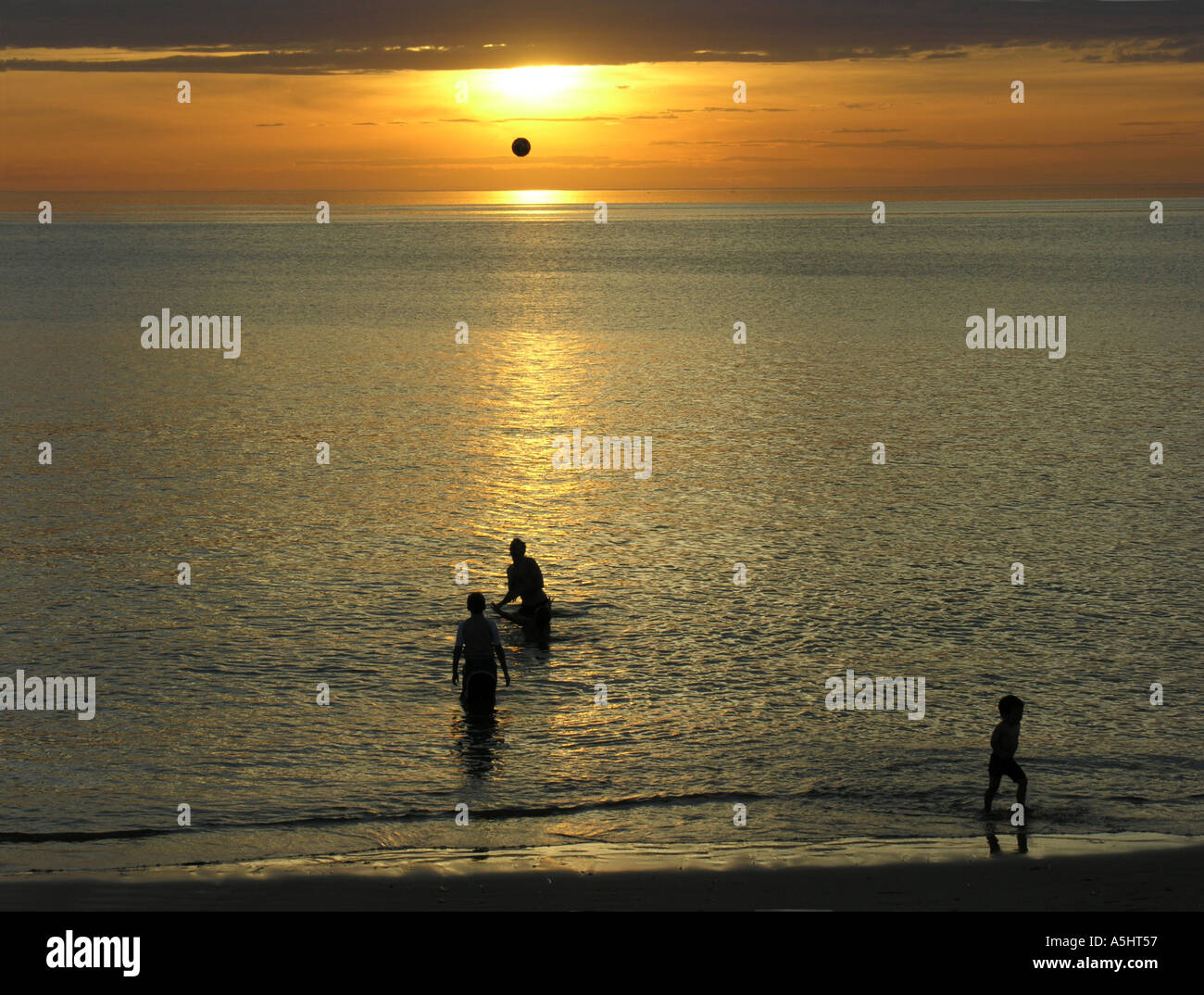 Child Throwing Ball Into Water High Resolution Stock Photography and ...