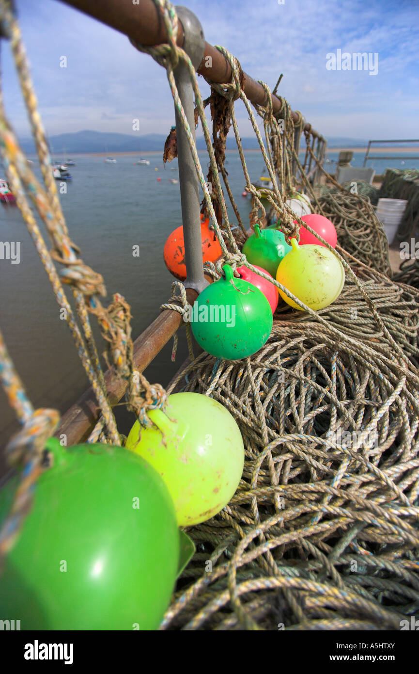 Colour marker buoys and coils of tethering rope on Aberdovey promenade ...