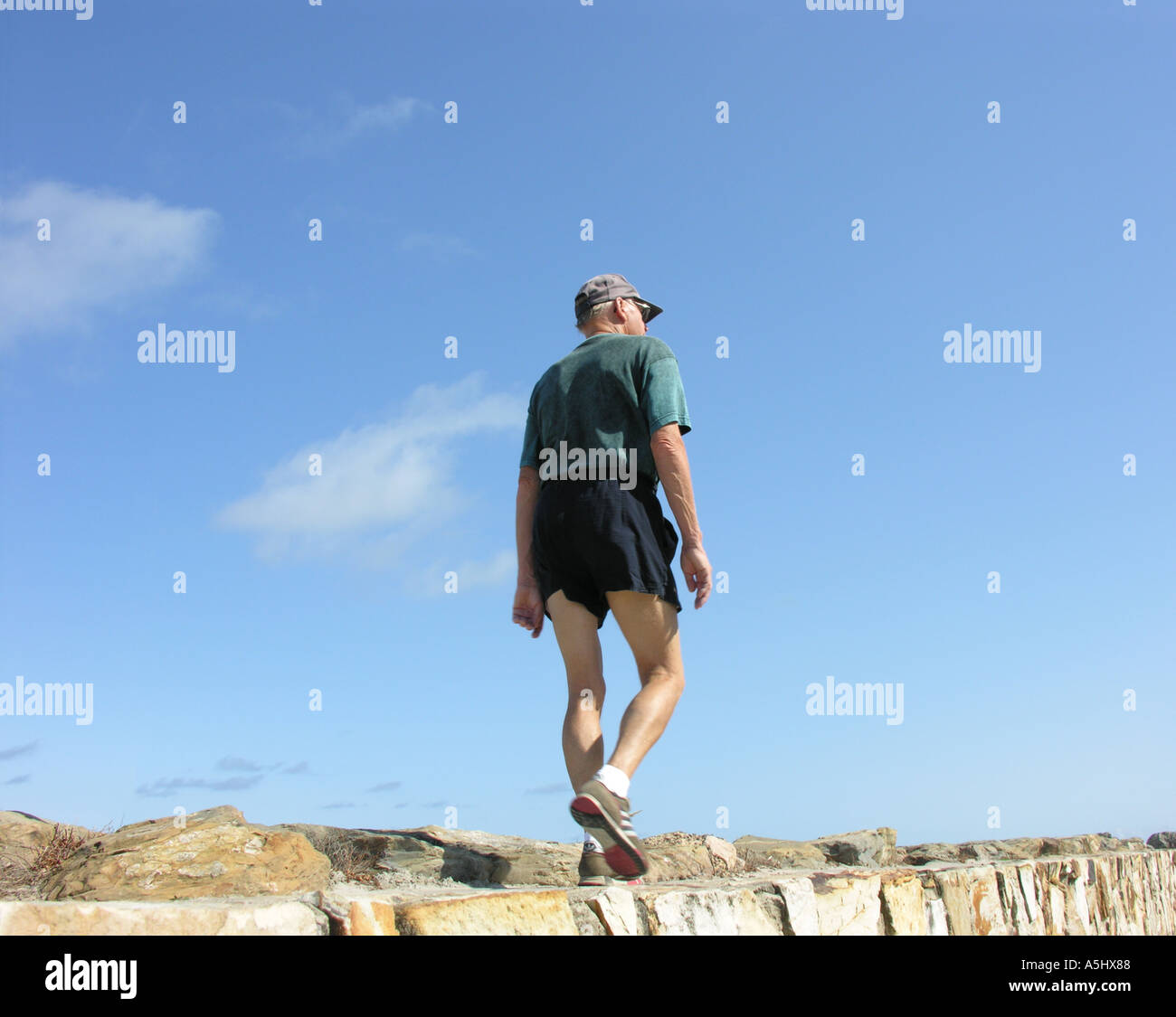 Man walking stone wall hi-res stock photography and images - Alamy