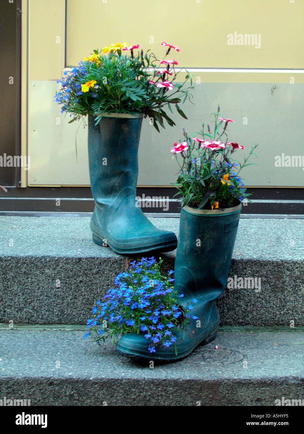 old rubber boots decorated with flowers Stock Photo - Alamy