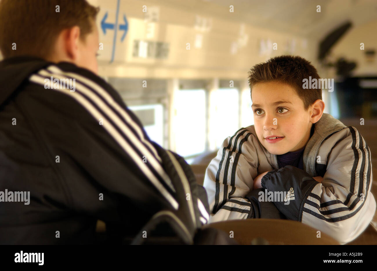 Kids on school bus Stock Photo - Alamy