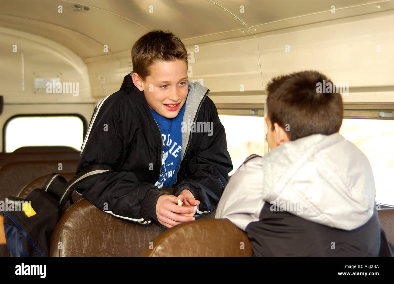 Children talking school bus hi-res stock photography and images - Alamy
