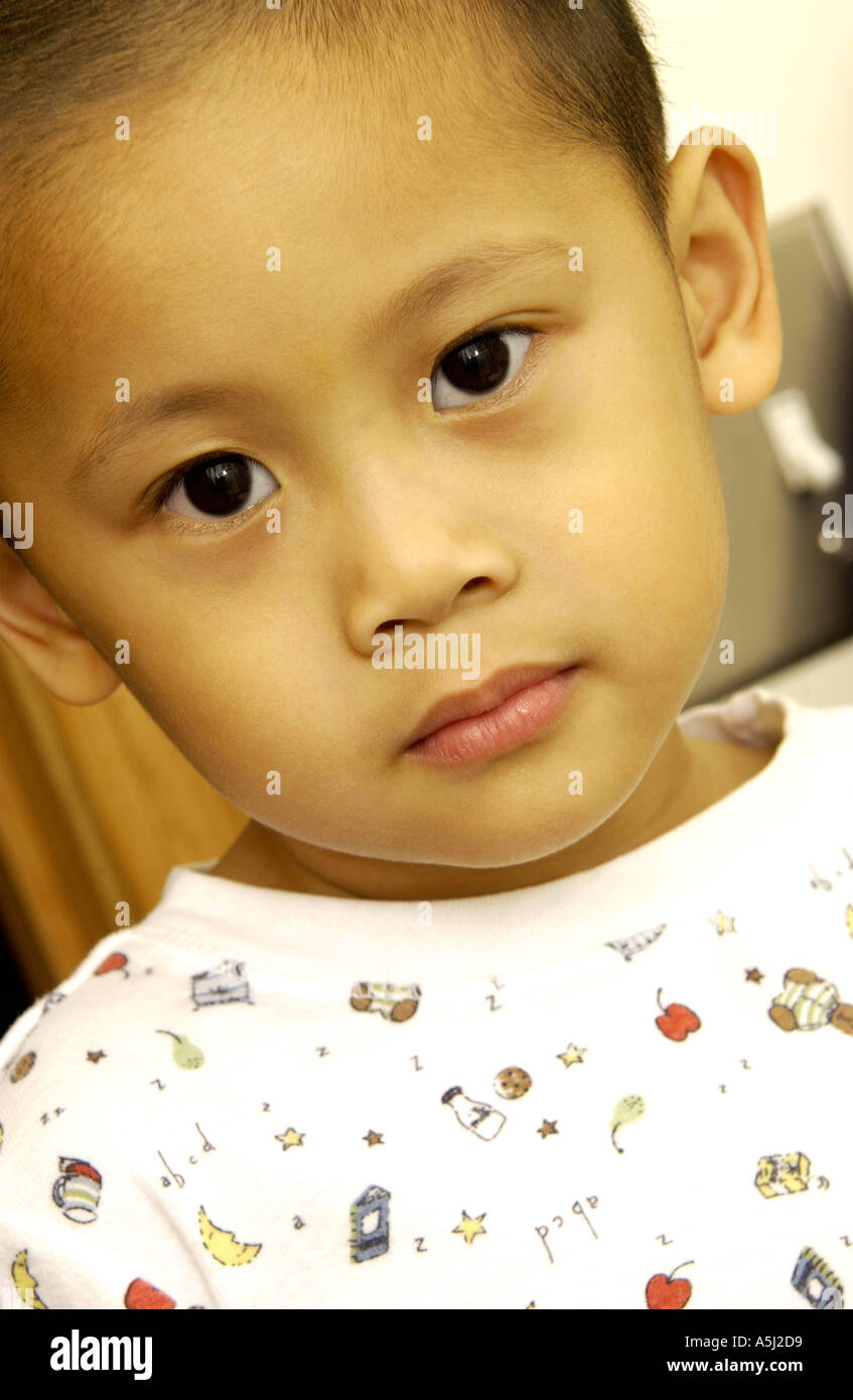 Asian boy in pajamas Stock Photo - Alamy