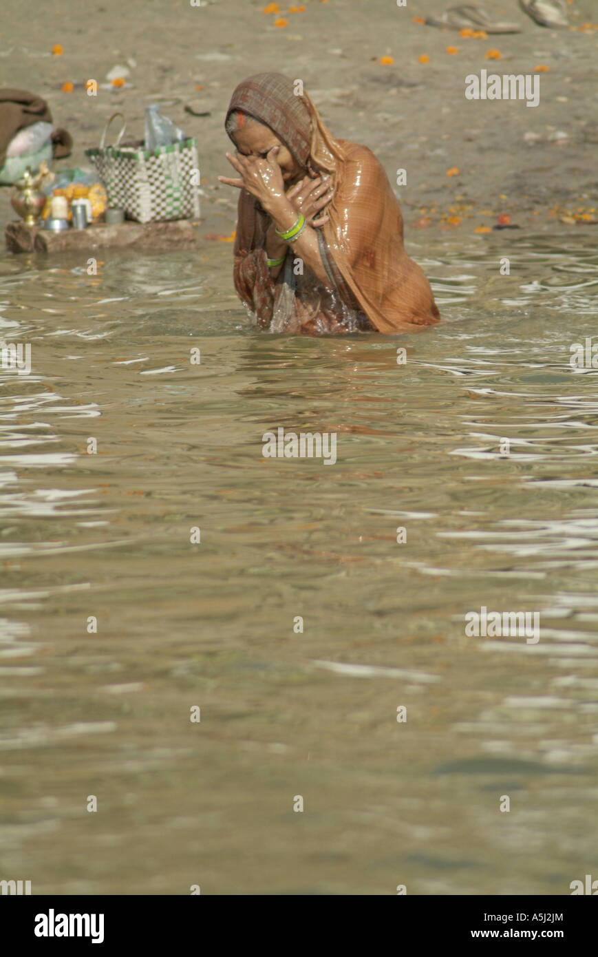 Woman bathing in the Ganges River in Varanasi, India Stock Photo - Alamy