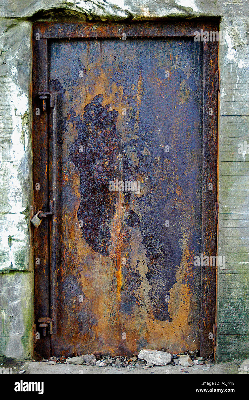 Mysterious locked rusty door Stock Photo - Alamy