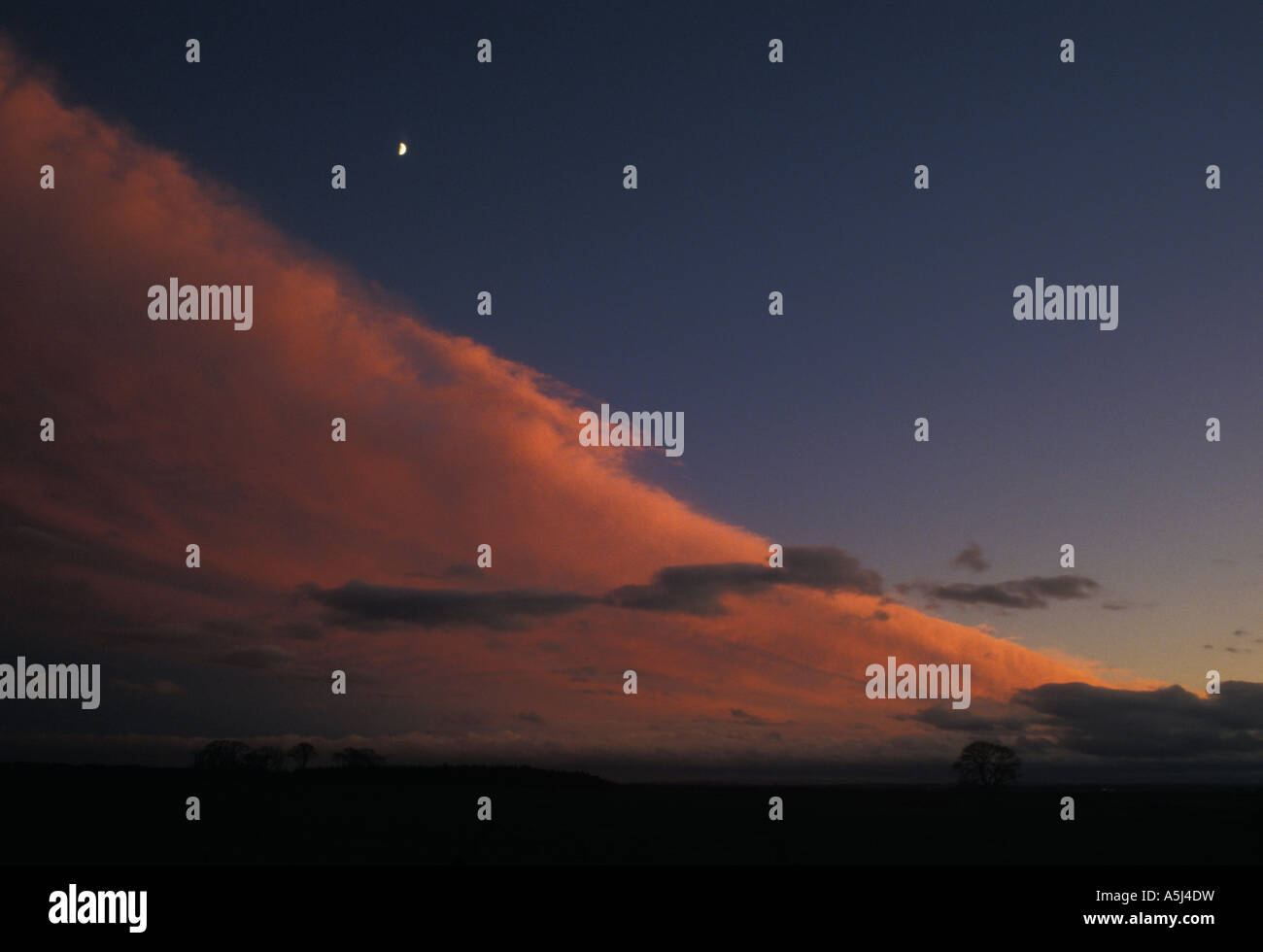 Orange cloud and moon Stock Photo - Alamy