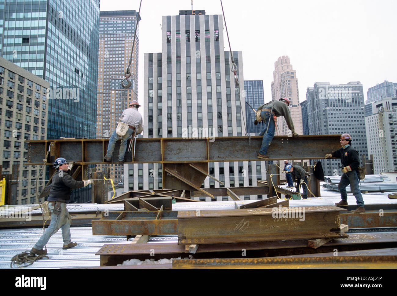 Iron worker connectors ride on beam at Random House building at 1540 ...