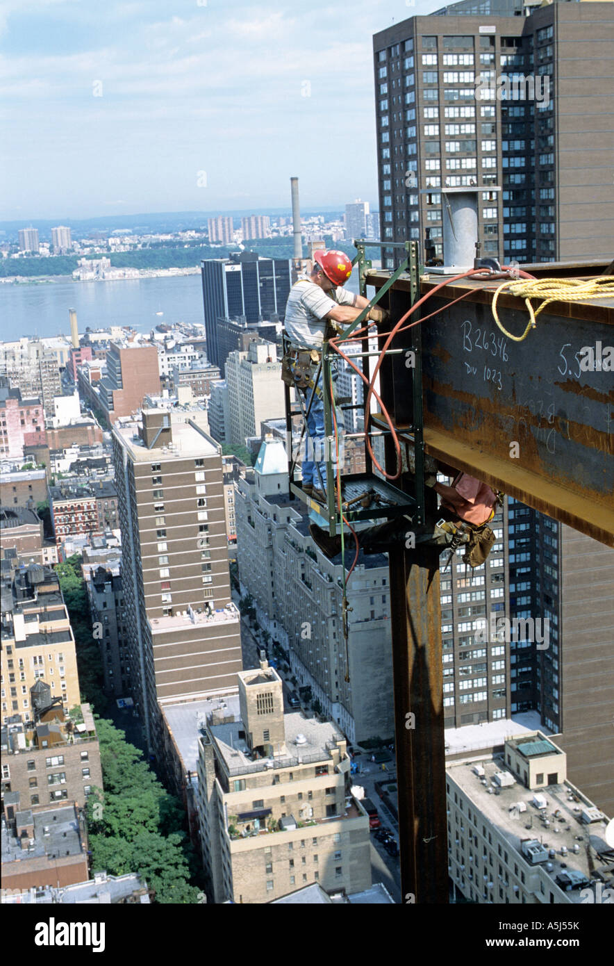 Iron workers connect steel frame at Random House building at 1745 ...