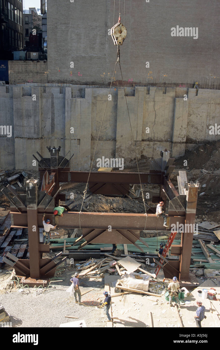 Iron workers connect beams to 24,000 pound support columns for new ...