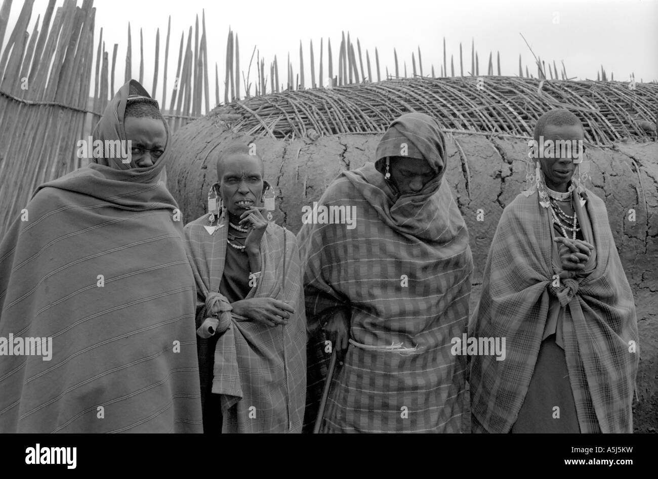 Masai villagers in traditional dress Black and White Stock Photos ...