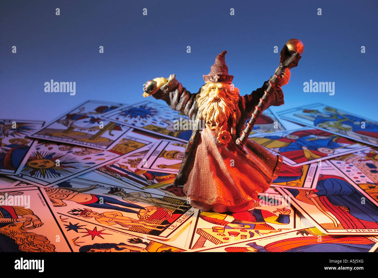 Wizard Figurine and Tarot Cards Stock Photo - Alamy