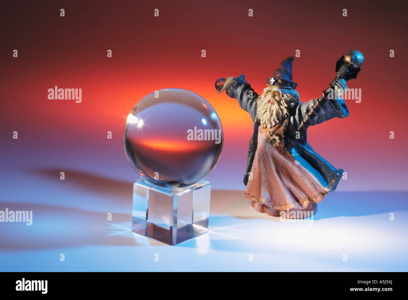 Wizard Figurine and Crystal Ball Stock Photo - Alamy