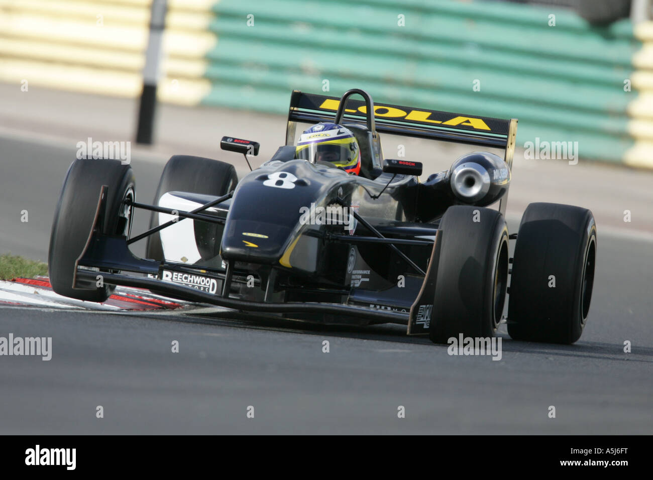Taking the corner at Clervaux, Croft racing circuit Stock Photo - Alamy