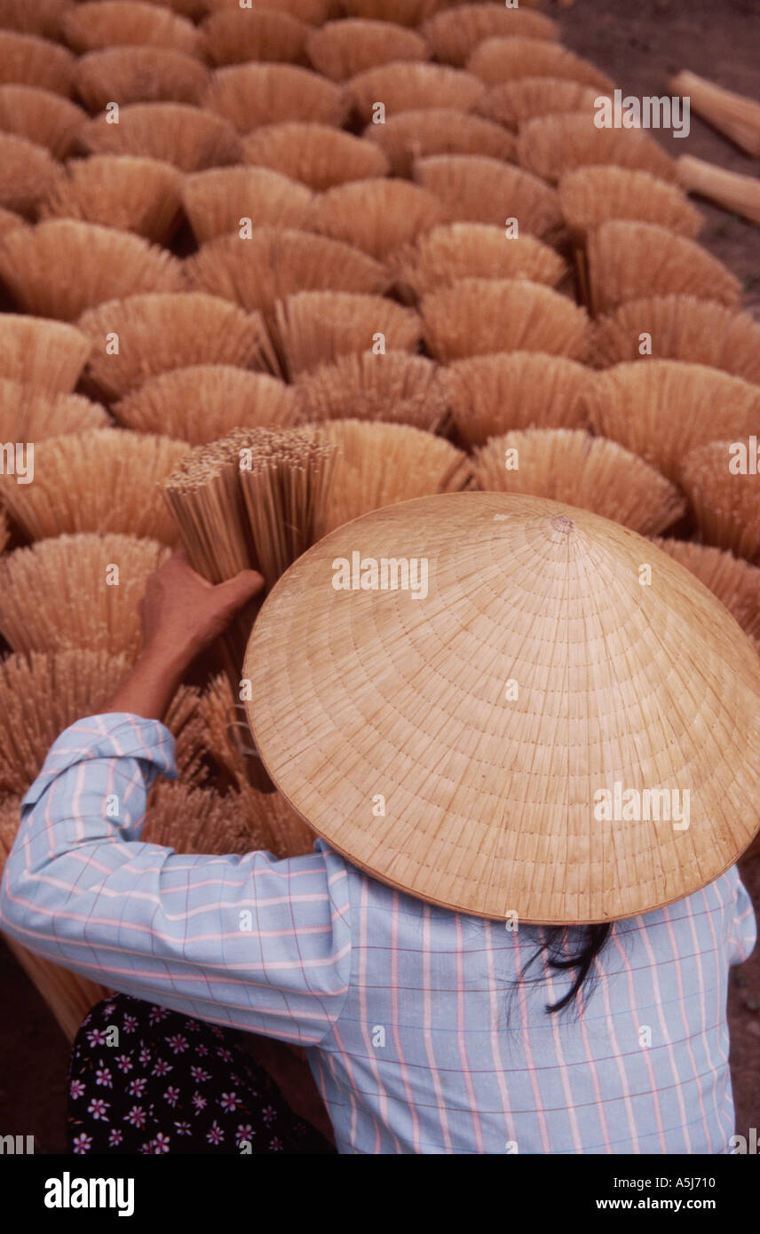 Incense maker wearing conical hat, Hue, Vietnam Stock Photo - Alamy
