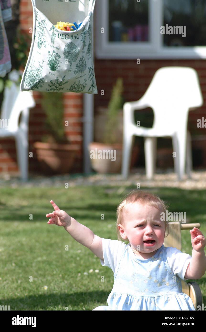 British toddler in garden crying London UK Stock Photo - Alamy
