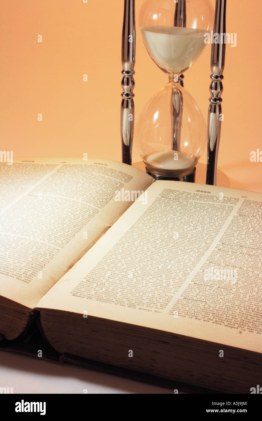 Hourglass and Book Stock Photo - Alamy