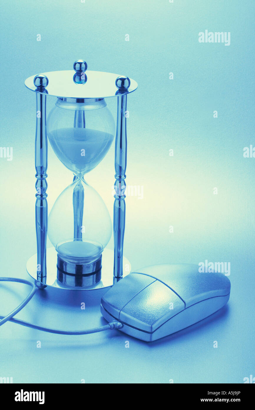 Hourglass and Computer Mouse Stock Photo - Alamy