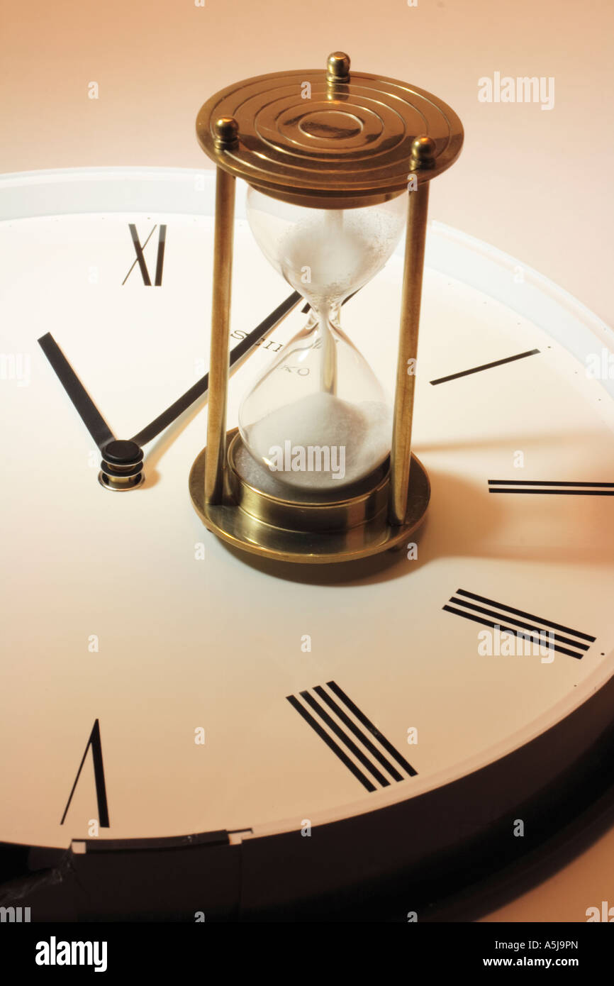 Hourglass on Clock Stock Photo - Alamy