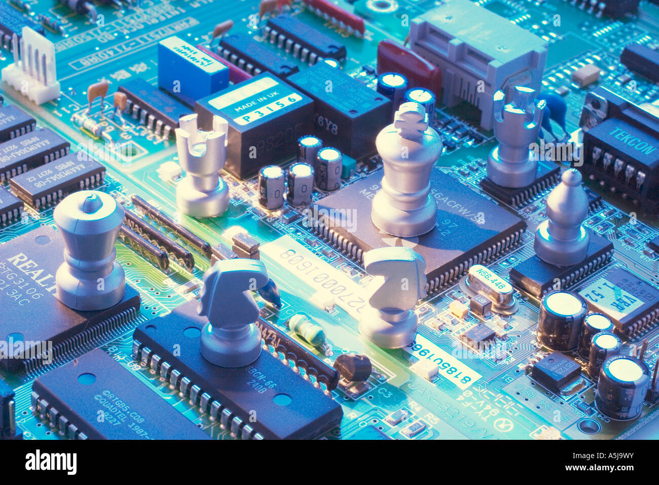 Chess Pieces on Circuit Board Stock Photo - Alamy