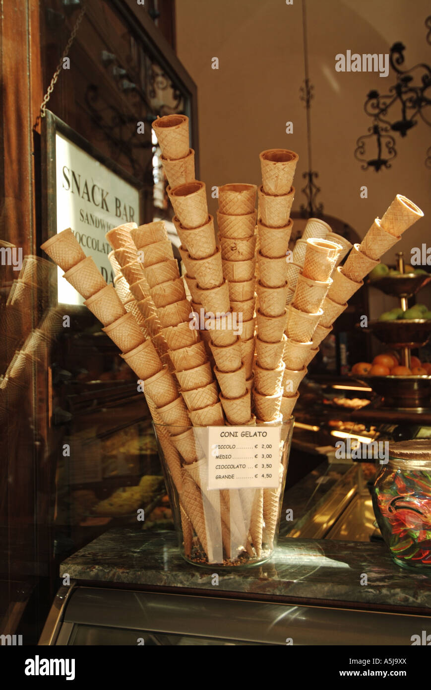 Close up of Ice cream cone wafer cornets display on counter of Italian ...