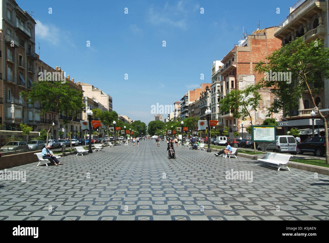 Bold paving slabs pattern on blue sky day on Spanish Rambla Nova wide ...