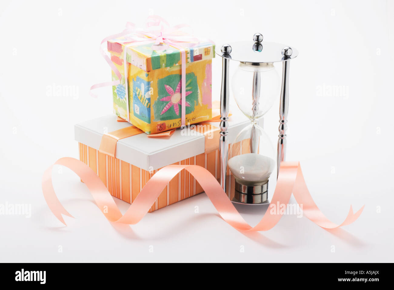 Hourglass and Gift Boxes Stock Photo - Alamy
