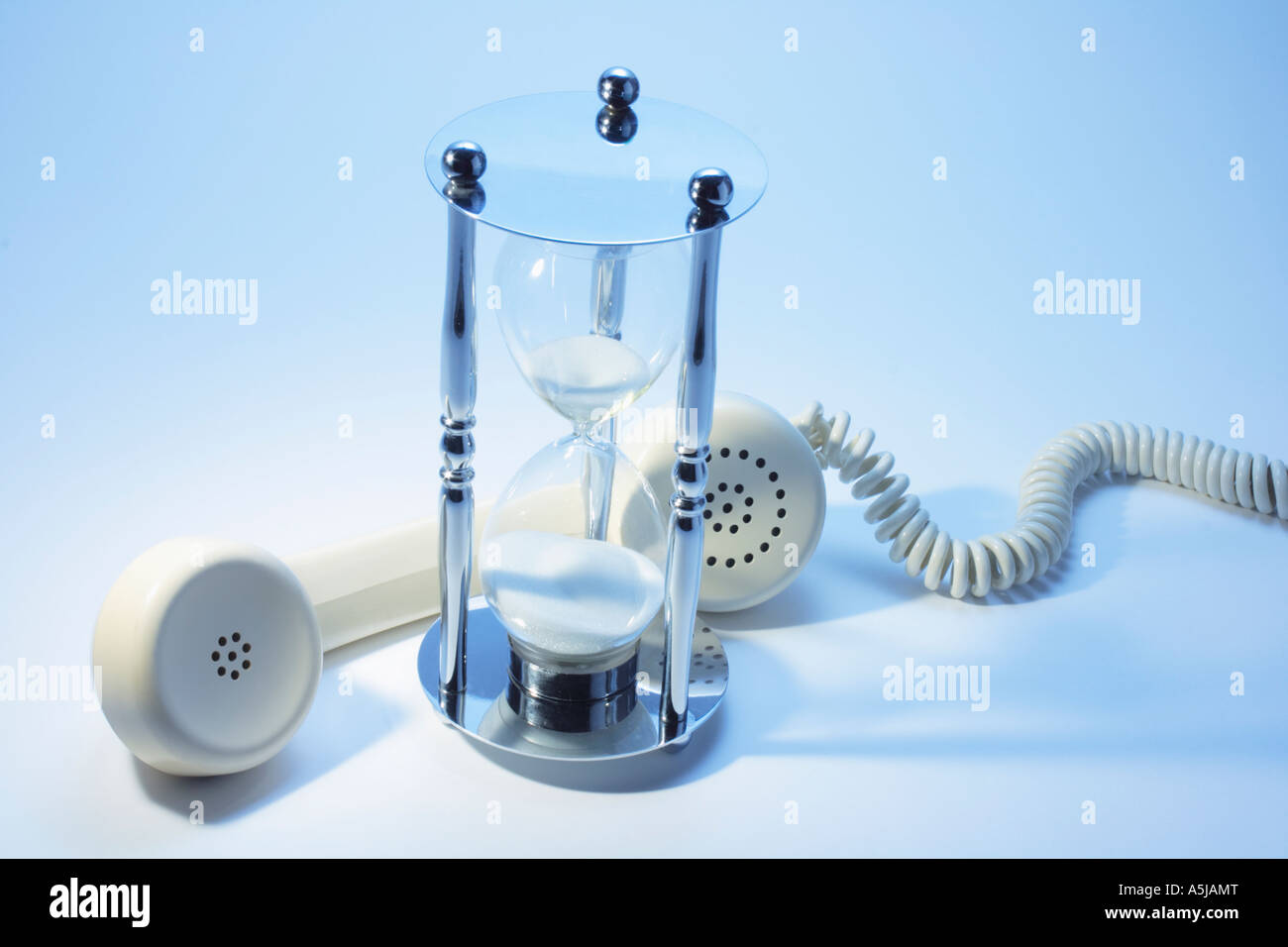 Hourglass and Telephone Handset Stock Photo - Alamy