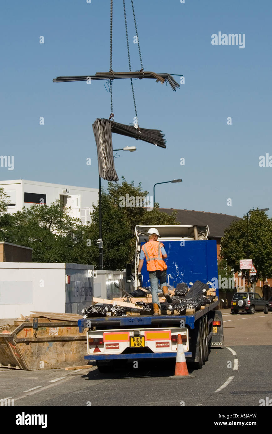 Construction site entrance articulated lorry load of steel ...