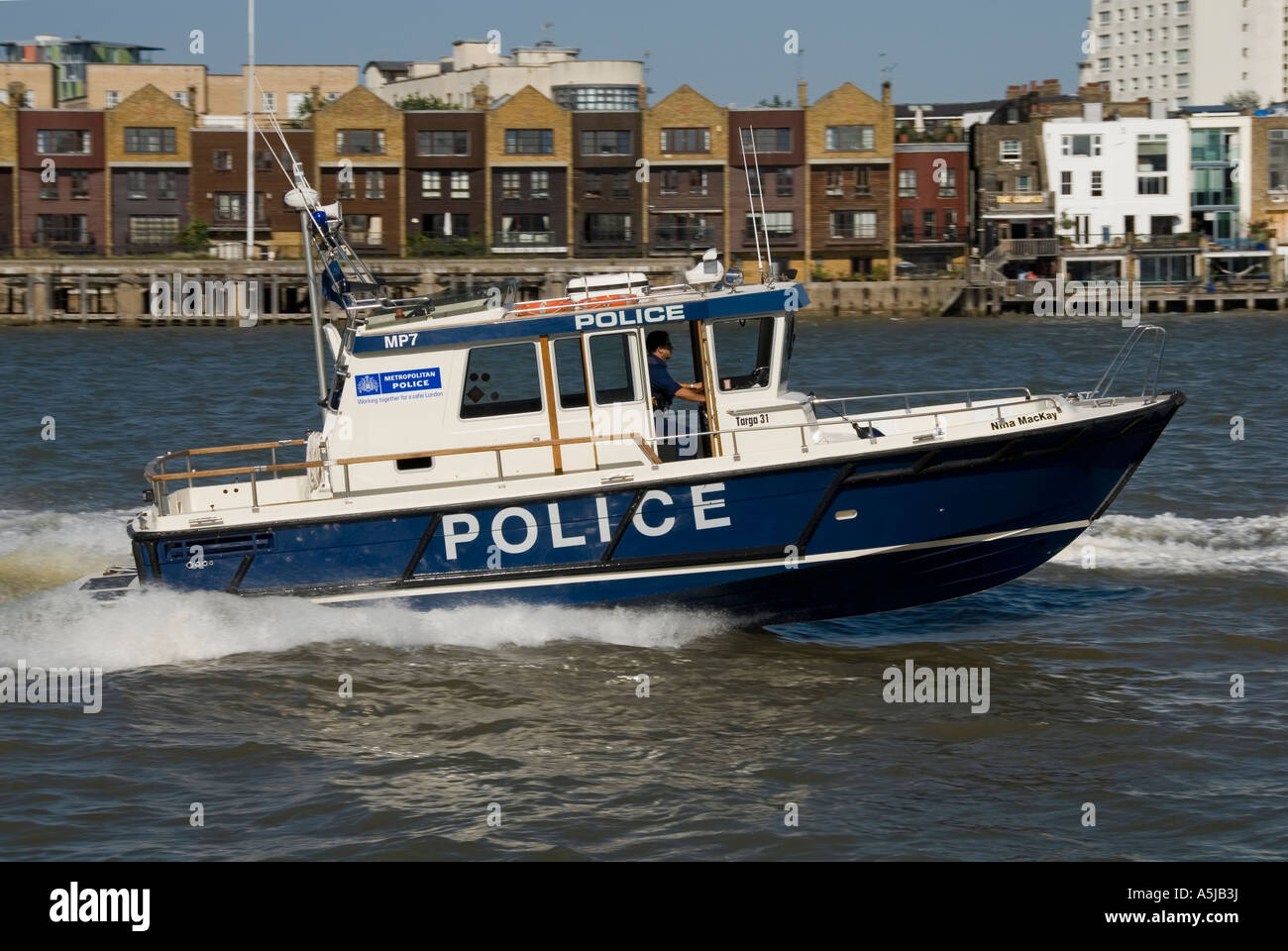 London River Thames Metropolitan Police motor patrol boat at high speed ...