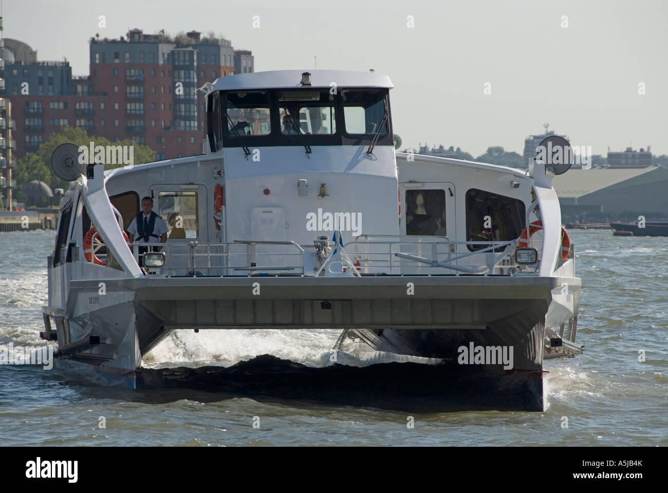 River boat catamaran commuter & tourist service on Thames approaching ...