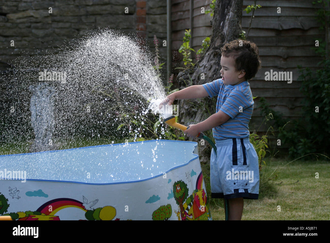 Paddling pool filling hi-res stock photography and images - Alamy