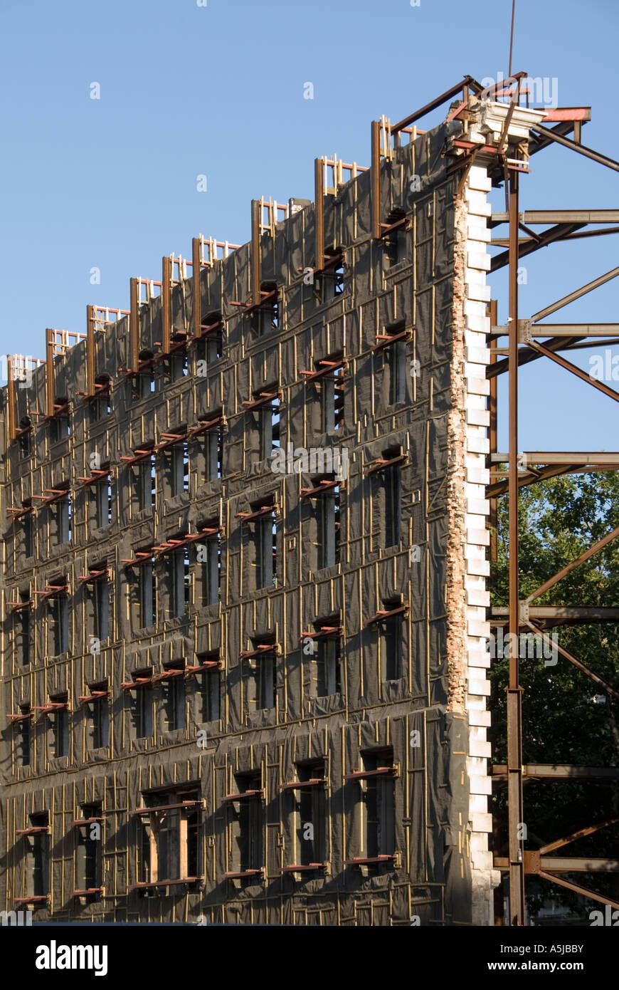 Temporary steel shoring for support to retained masonry facade of old ...