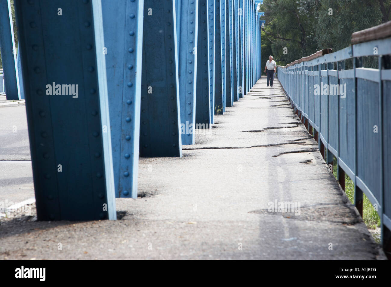 Man Crossing Bridge Stock Photo - Alamy