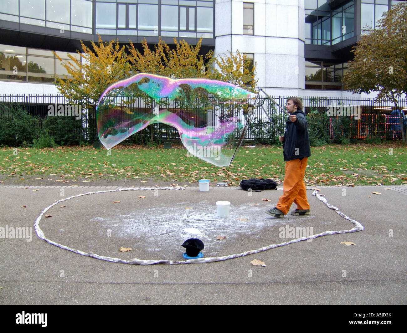 Street entertainer making giant bubbles. London South Bank UK Stock ...