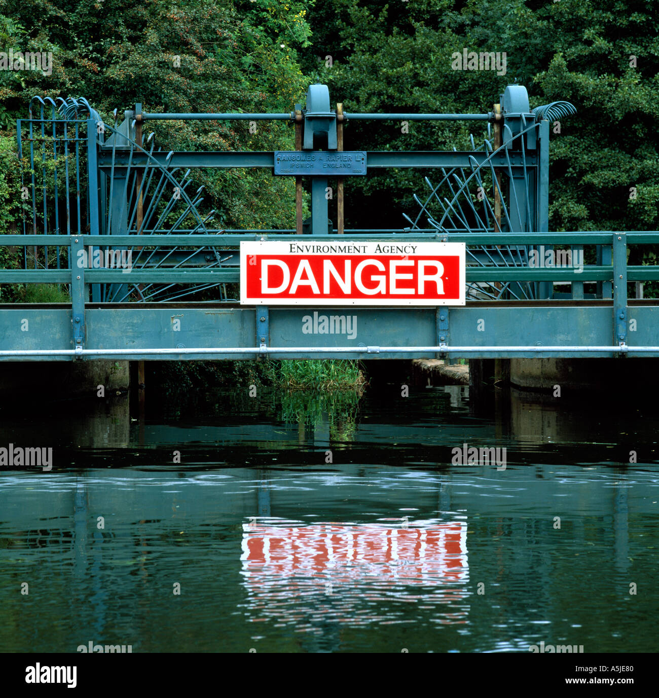 Danger Sign on River Wey Guildford Surrey U K with still water and ...
