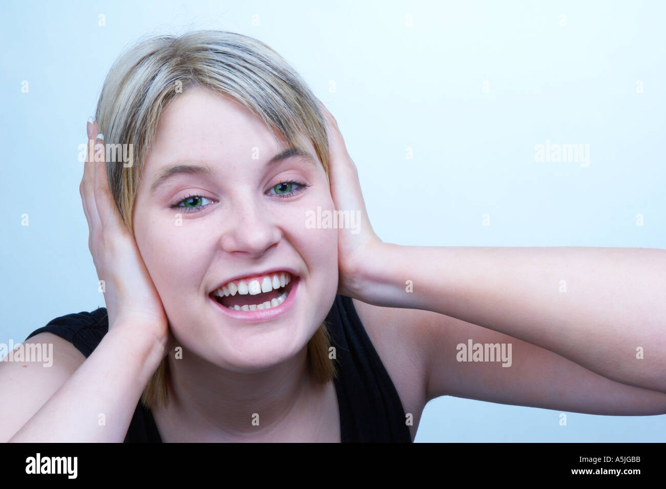 Teenage Girl Too Loud Bleeched Blue Horizontal Stock Photo - Alamy