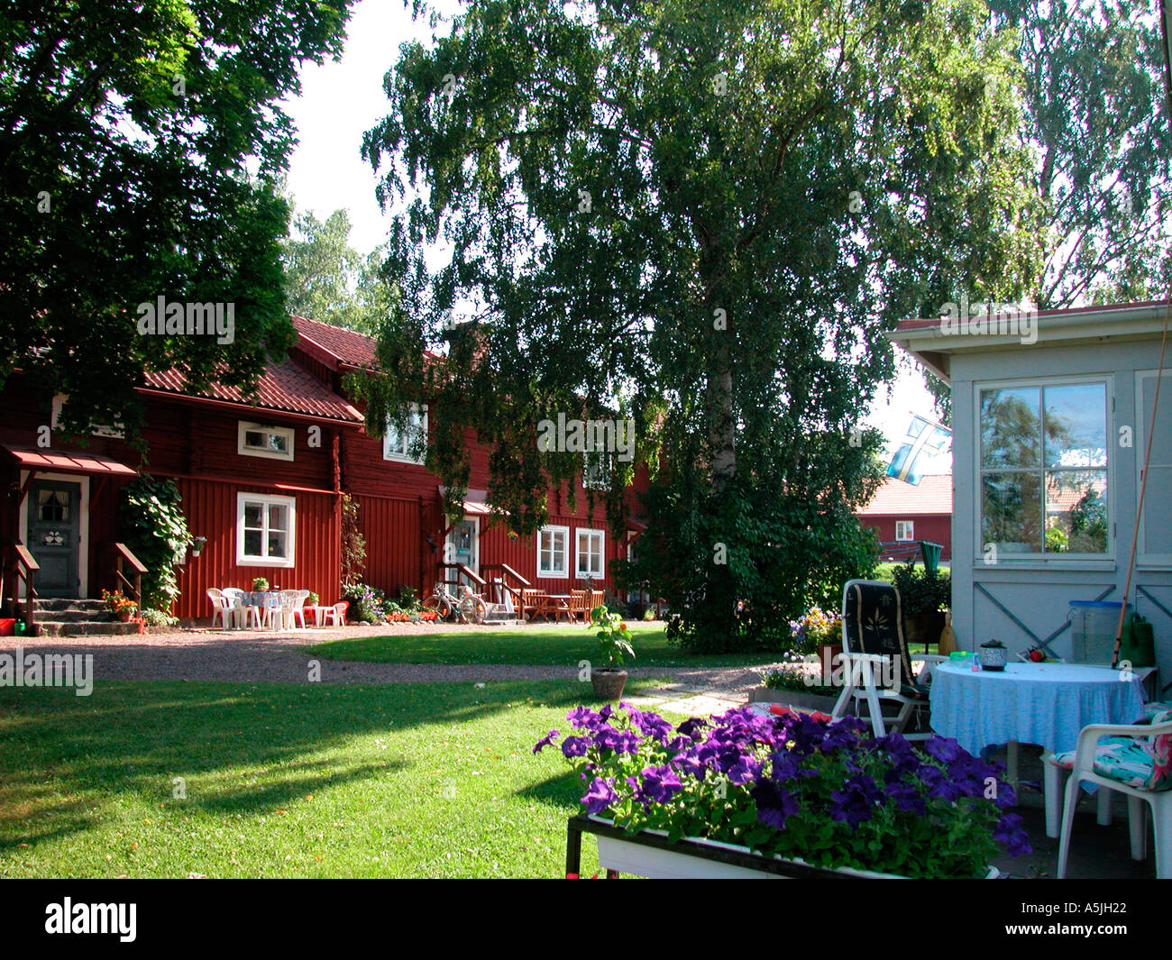 old red wooden houses with green spaces in the town Avesta Sweden Stock ...