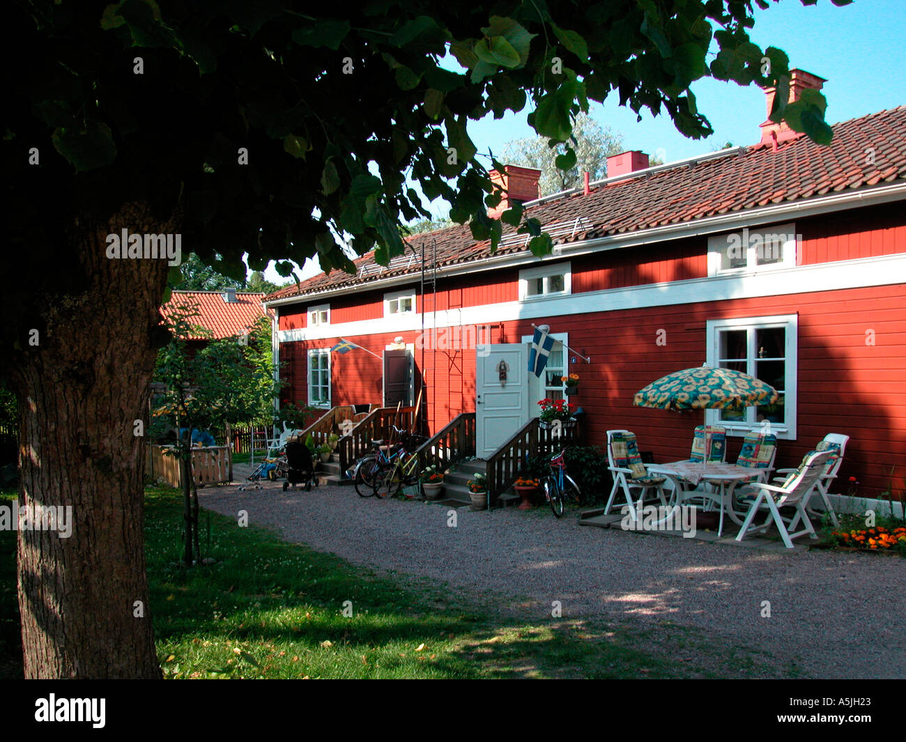 old red wooden houses with green spaces in the town Avesta Sweden Stock ...