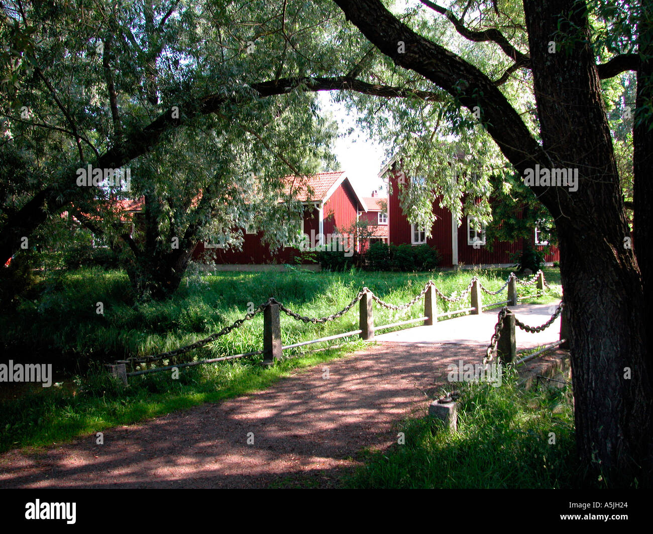 old red wooden houses in green spaces in the town Avesta Sweden Stock ...
