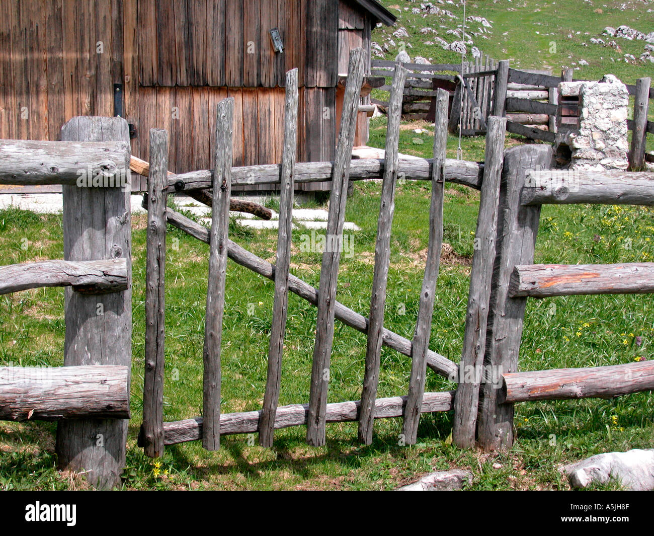 gate to a Alpine hut in the Alps on the plateau Velinka Planina in ...
