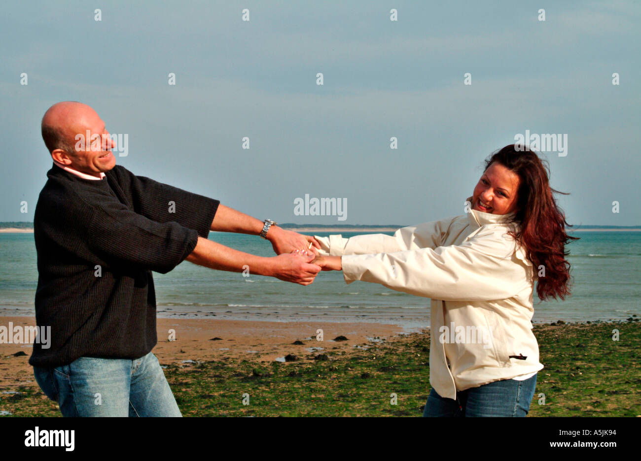 Lovers walking seacoast on hi-res stock photography and images - Alamy