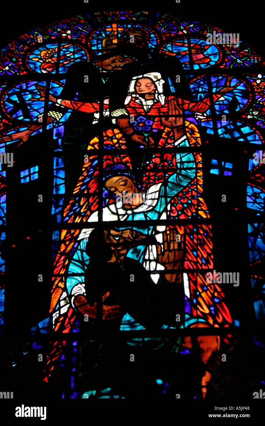 A Stained Glass window depicting peace among the nations of the world ...