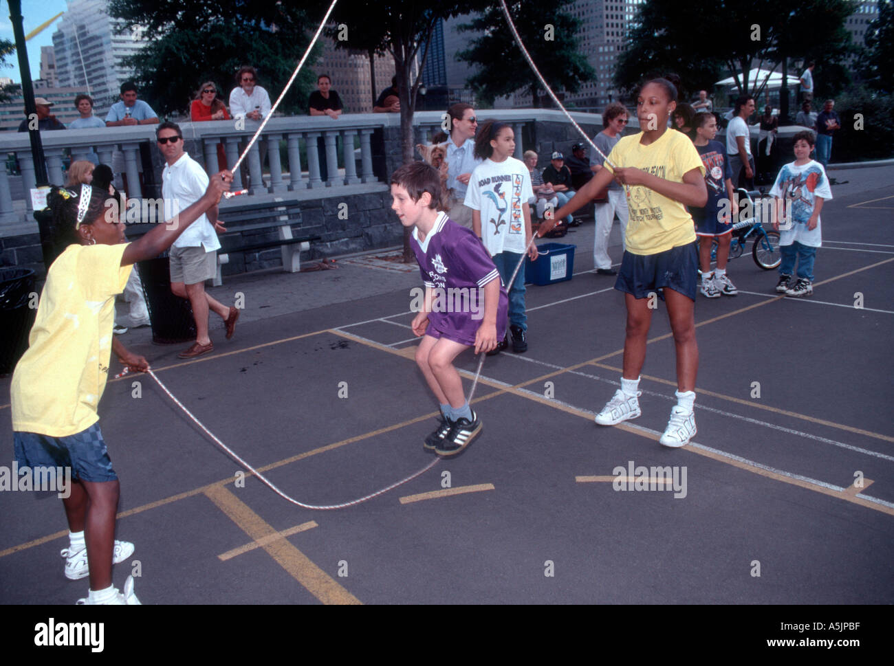 A young man demonstrates his double dutch skills in Hudson River Park ...