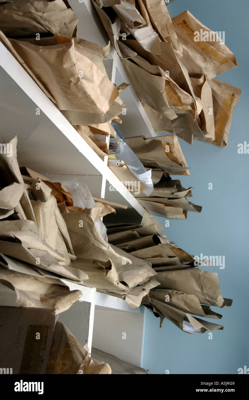 Over-stacked shelves in office Stock Photo - Alamy