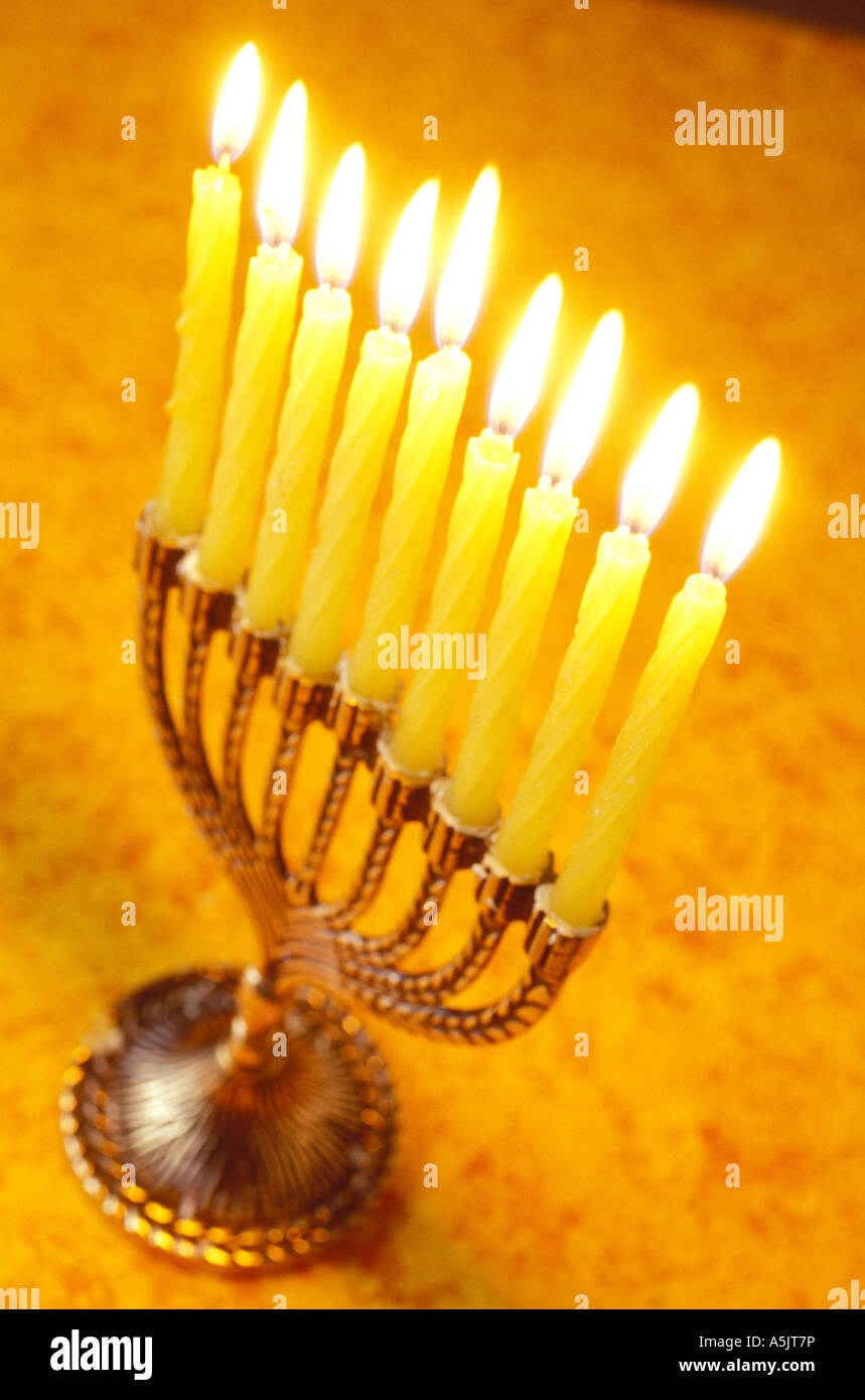 Menorah with yellow candles Stock Photo - Alamy