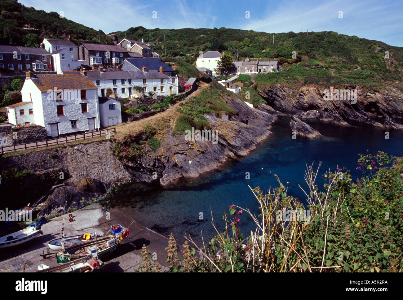 Cottages above the harbour in the fishing village of Portloe on the ...